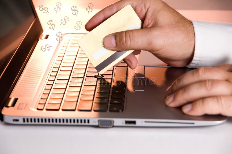 Person Using a Credit Card and a Laptop Making a Purchase on the ...
