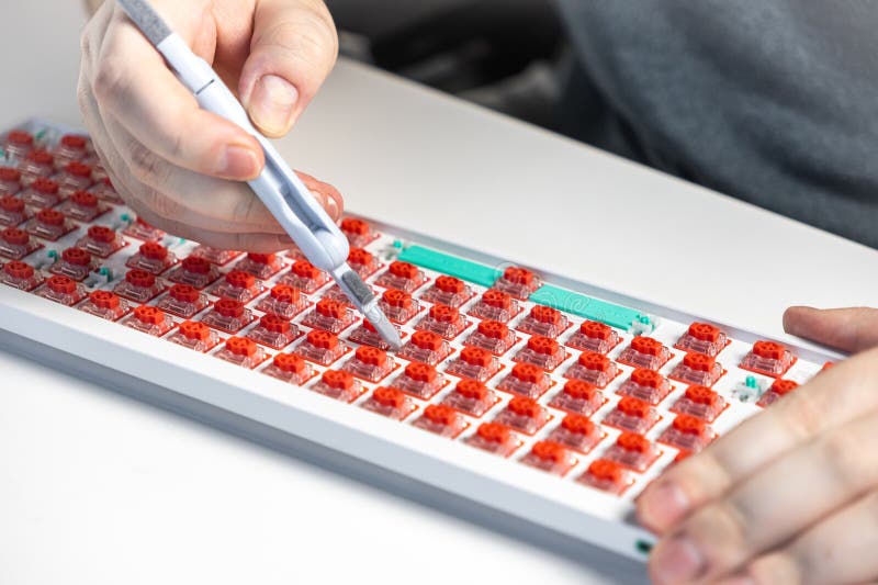 Person Using Diagnostic Tool To Test Red Mechanical Switches on ...