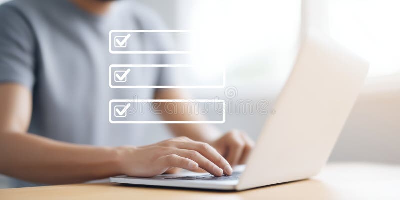 Individual Typing on a Laptop with Checkboxes Displayed on the Screen ...