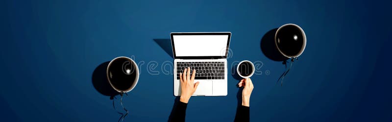 Person Using a Laptop Computer with Black Balloons Stock Photo - Image ...