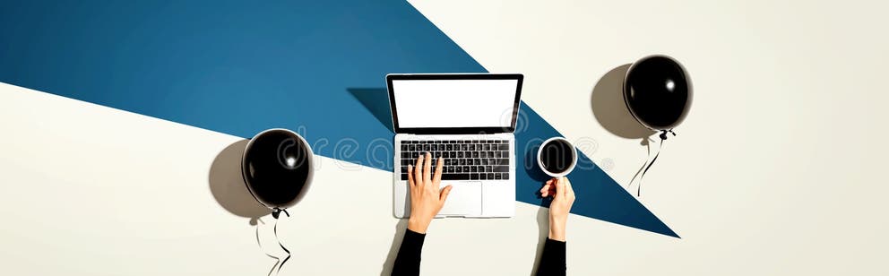 Person Using a Laptop Computer with Black Balloons Stock Image - Image ...