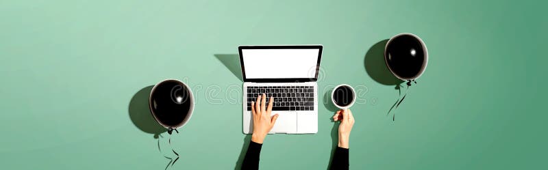 Person Using a Laptop Computer with Black Balloons Stock Image - Image ...
