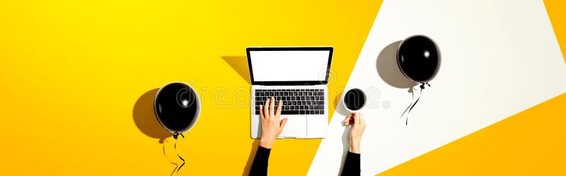 Person Using a Laptop Computer with Black Balloons Stock Photo - Image ...