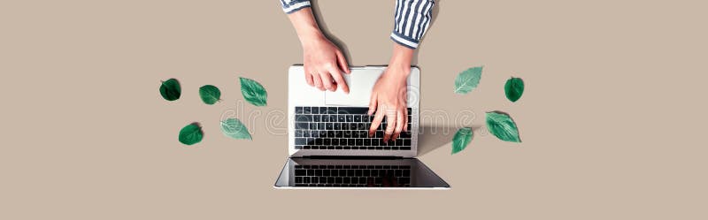 Person Using a Laptop Computer with Green Leaves Stock Photo - Image of ...