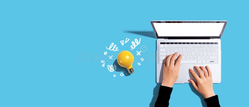 Person Using a Laptop Computer and a Light Bulb Stock Photo - Image of ...