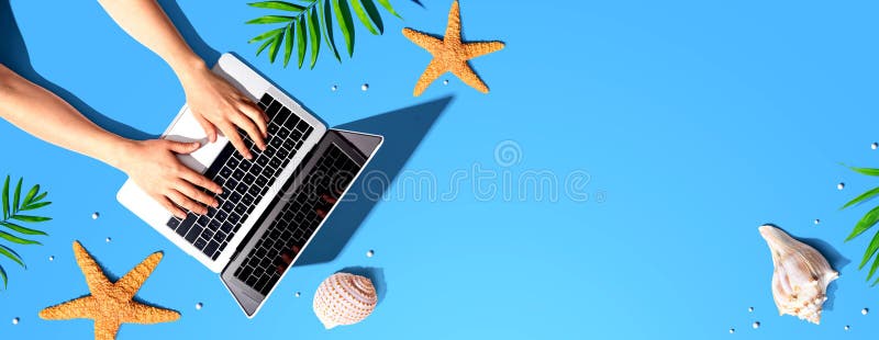Person Using a Laptop Computer with Summer Theme Objects Stock Image ...