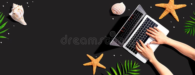 Person Using a Laptop Computer with Summer Theme Objects Stock Image ...