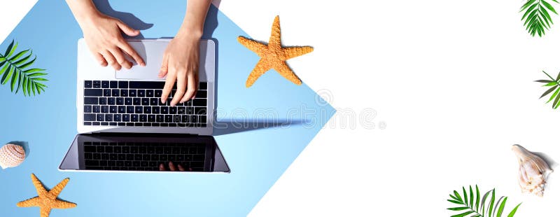 Person Using a Laptop Computer with Summer Theme Objects Stock Image ...