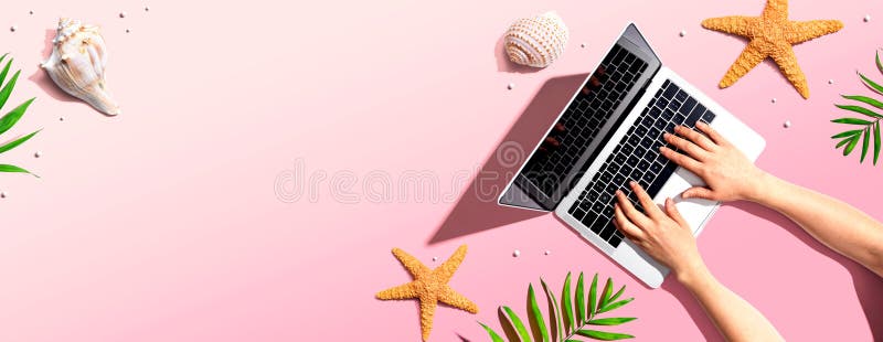 Person Using a Laptop Computer with Summer Theme Objects Stock Photo ...