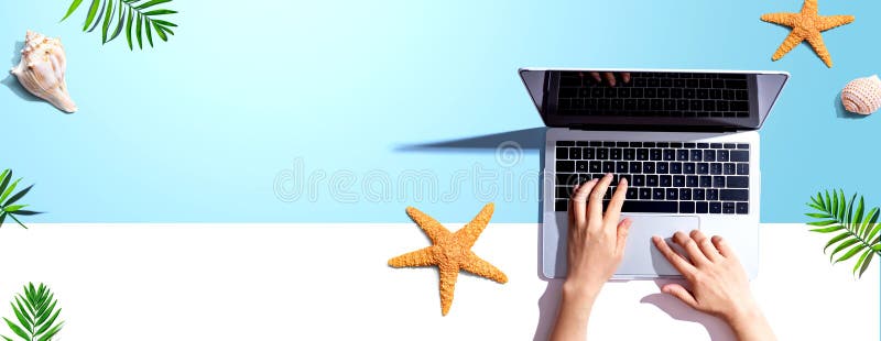 Person Using a Laptop Computer with Summer Theme Objects Stock ...