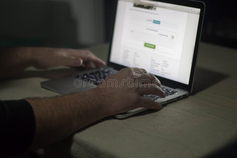Person Using Laptop in Dark Room. Moody, Sinister. Stock Photo - Image ...