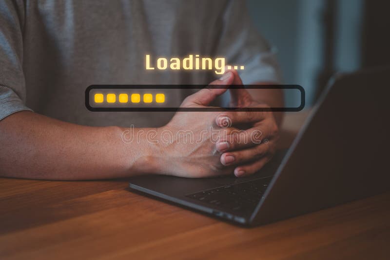 Person Using a Laptop for Download To Loading Digital Business Data ...