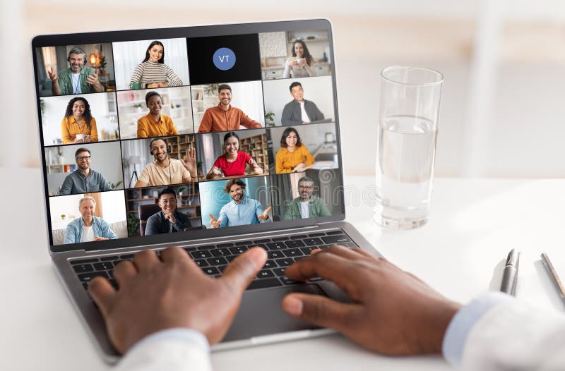 Person Using Laptop for Virtual Meeting with Multiple Participants ...