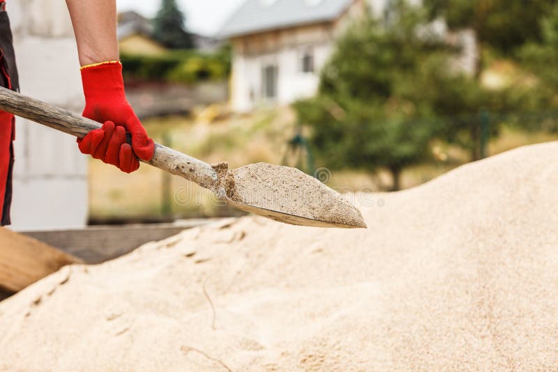 Person Using Shovel on Construction Site Stock Photo - Image of sand ...