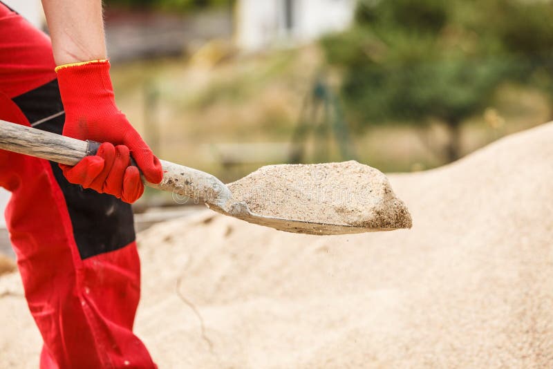 Person Using Shovel on Construction Site Stock Photo - Image of sand ...