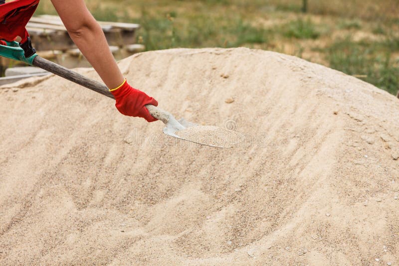Person Using Shovel on Construction Site Stock Photo - Image of person ...