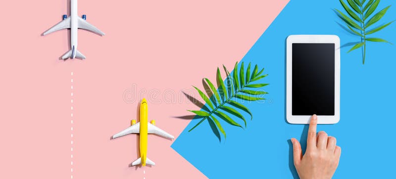 Person Using a Tablet Computer with Small Airplanes Stock Photo - Image ...