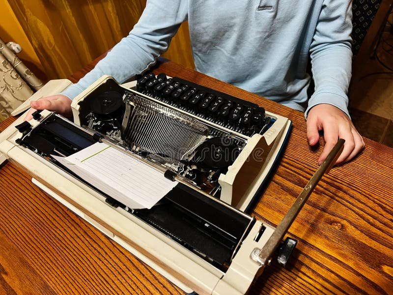 Person Using Vintage Typewriter at Wooden Desk Creating Written ...