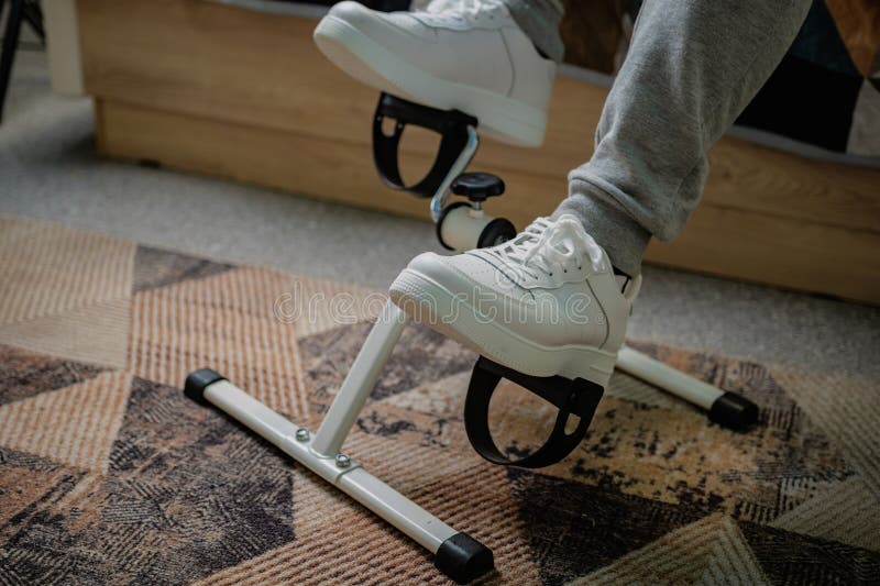 Person Using White Peddler Exercise Machine while Sitting Stock Image ...