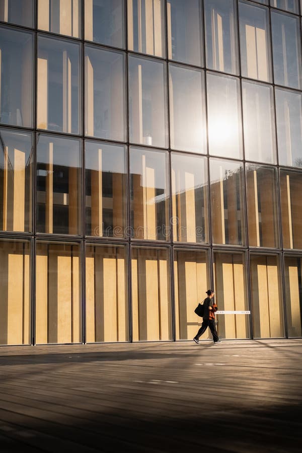 Person Walking by an Office Building on a Sunny Day Editorial Stock ...