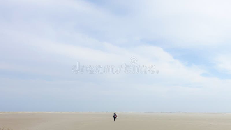 Person Walking through the Sand Under a Cloudy Sky at Daytime - Cool ...