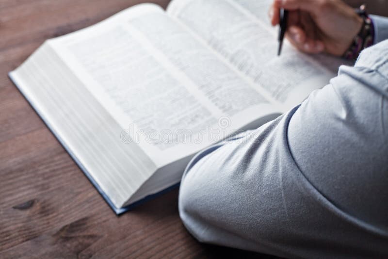 Person Who is Looking through a Book Stock Photo - Image of studying ...