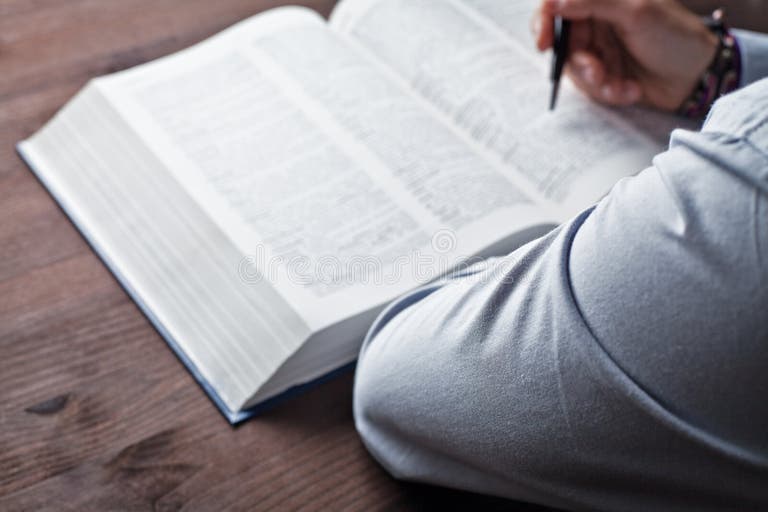 Person Who is Looking through a Book Stock Photo - Image of studying ...