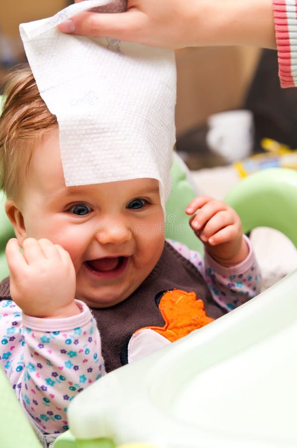 Person wiping head of baby stock image. Image of laughing - 17153015