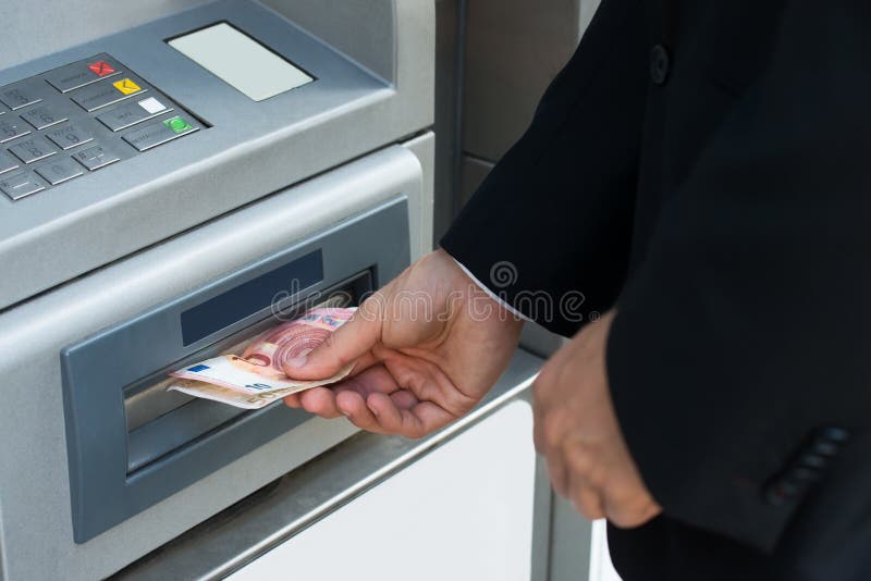 Taking money out of ATM stock image. Image of automatic - 45823317