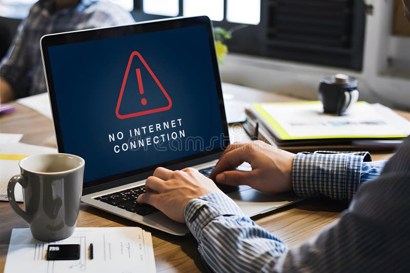 Person Working on Laptop with No Internet Connection Warning, Red ...