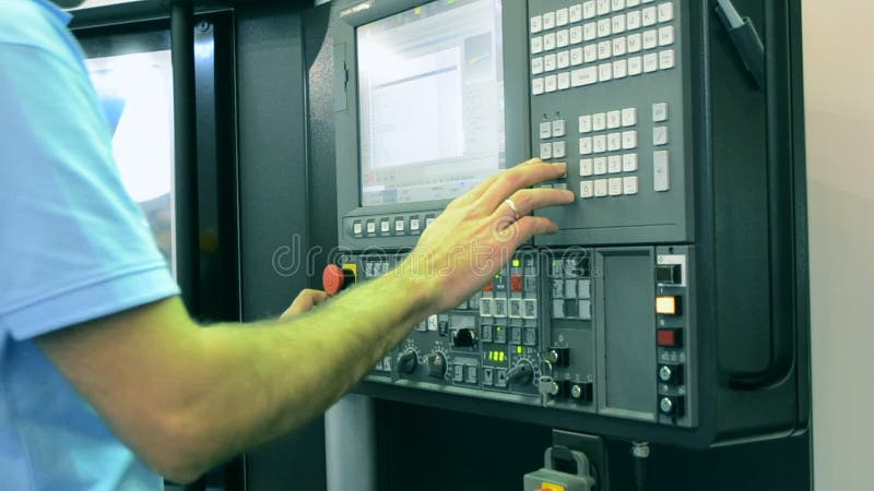 Person Works Behind the Control Panel of the Production Machine Stock ...