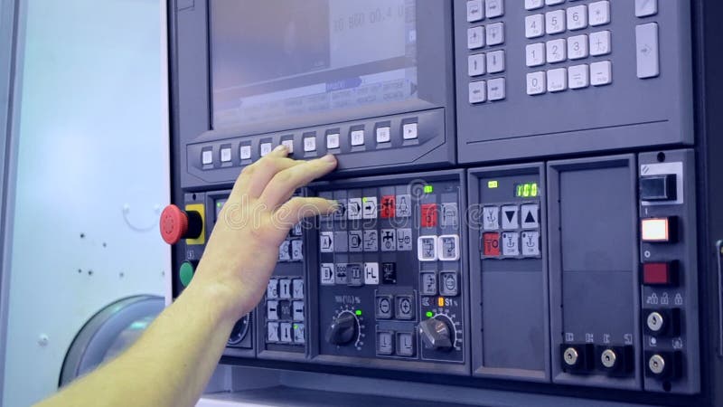 Person Works Behind the Control Panel of the Production Machine at the ...