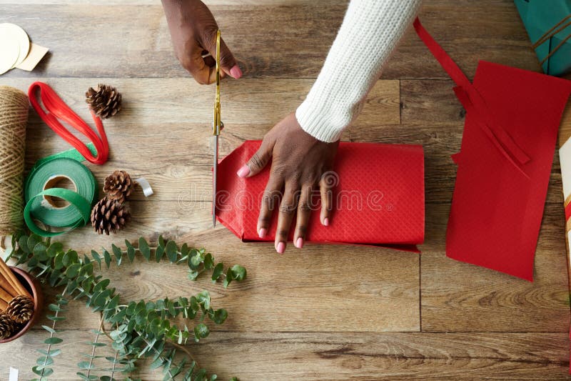 Person Wrapping Gift Boxes stock photo. Image of process - 294575590