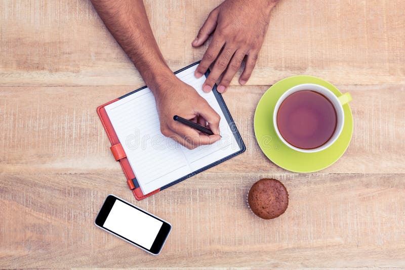 Person Writing on a Diary at the Desk Stock Photo - Image of caffeine ...