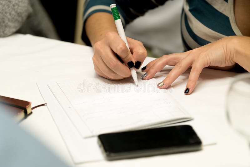 Person writing in notepad stock photo. Image of study - 114460314