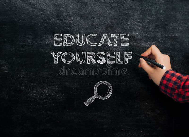 A Person is Writing the Word Educate Yourself on a Blackboard Stock ...