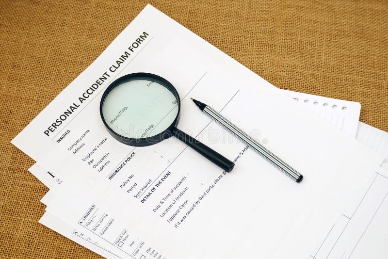 Personal Accident Claim Form, Magnifying Glass, Pen, and Paperwork ...