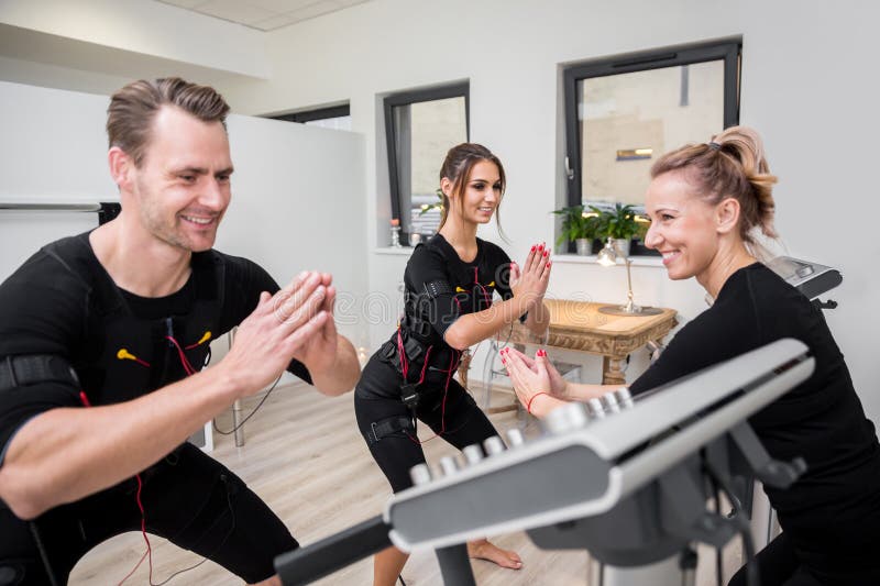 Personal Coach Showing Young People Correct Pose for Training Stock ...