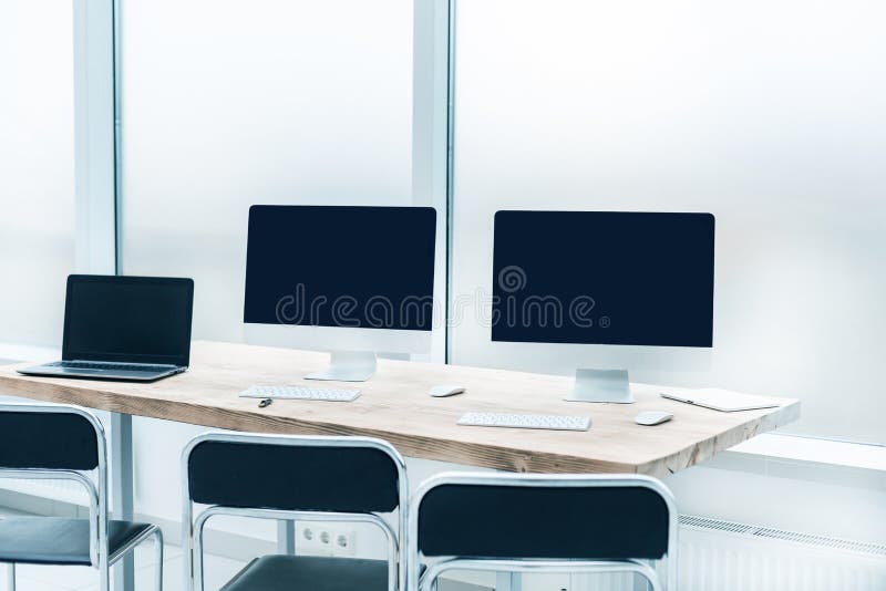 Personal Computers on a Desk in an Empty Office Stock Photo - Image of ...