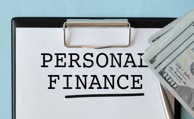 PERSONAL FINANCE Text on a Notebook with Clipboard and Calculator on a ...