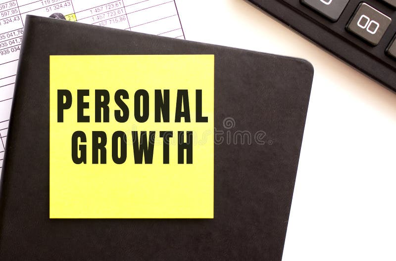 PERSONAL GROWTH Text on a Sticker on Your Desktop. Diary and Calculator ...