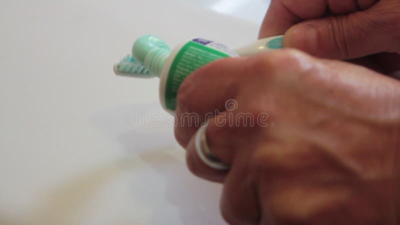 Personal Hygiene with Hands Squeezing Toothpaste on the Toothbrush ...