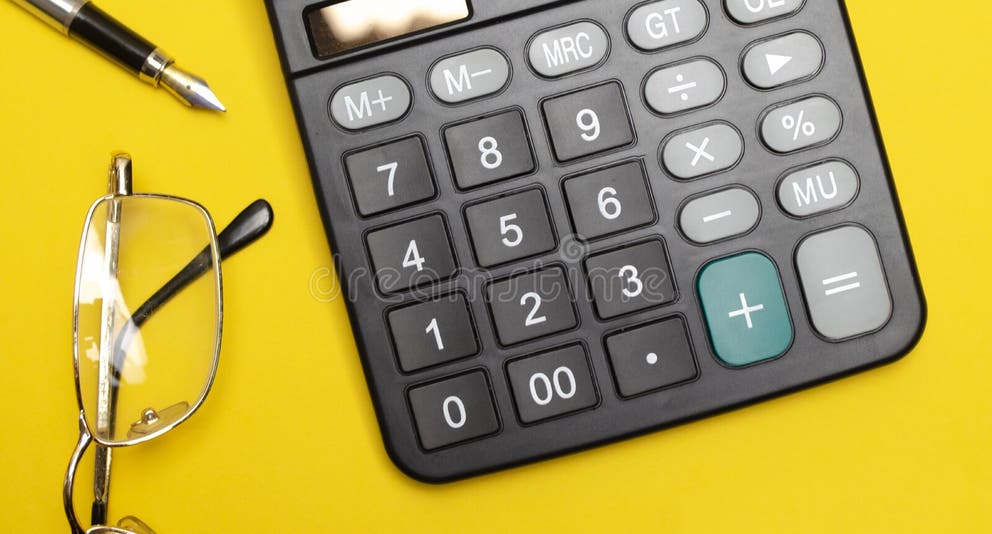 Personal Organizer and Calculator on Yellow Desk Stock Image - Image of ...