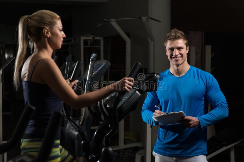 Personal Trainer and Client in Gym Stock Photo - Image of ethnicity ...