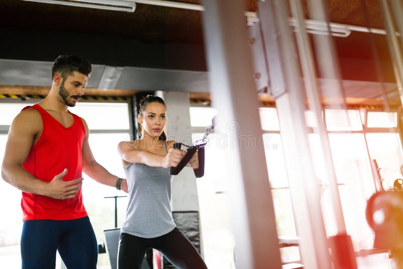 Personal Trainer Giving Instructions in Gym Stock Image - Image of ...