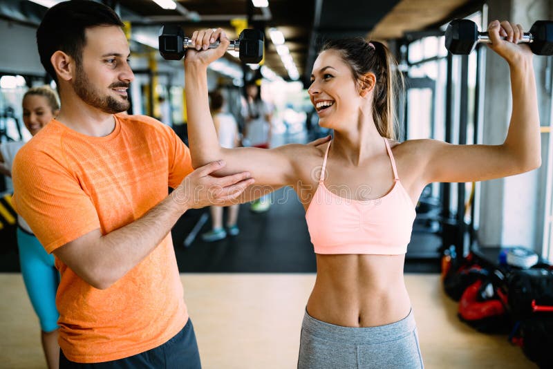 Personal Trainer Giving Instructions in Gym Stock Photo - Image of ...