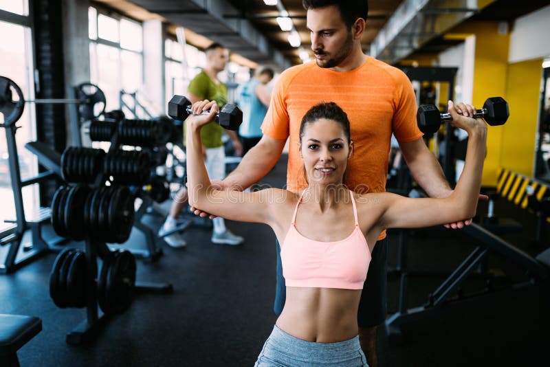 Personal Trainer Giving Instructions in Gym Stock Image - Image of ...