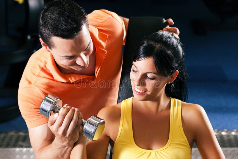 Personal Trainer in gym stock photo. Image of muscular - 12409294