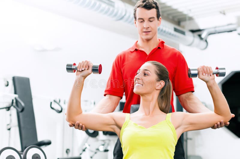 Personal Trainer in gym stock photo. Image of bells, health - 15160020