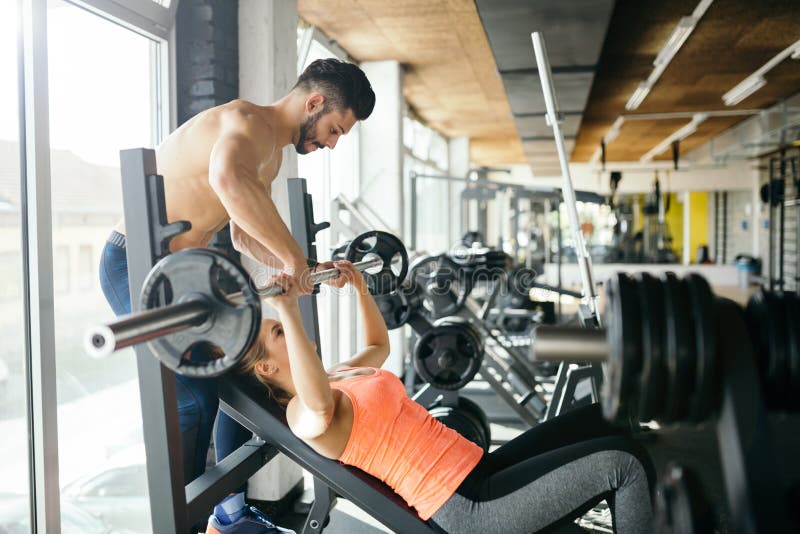 Personal trainer helping stock image. Image of bell, club - 78971877